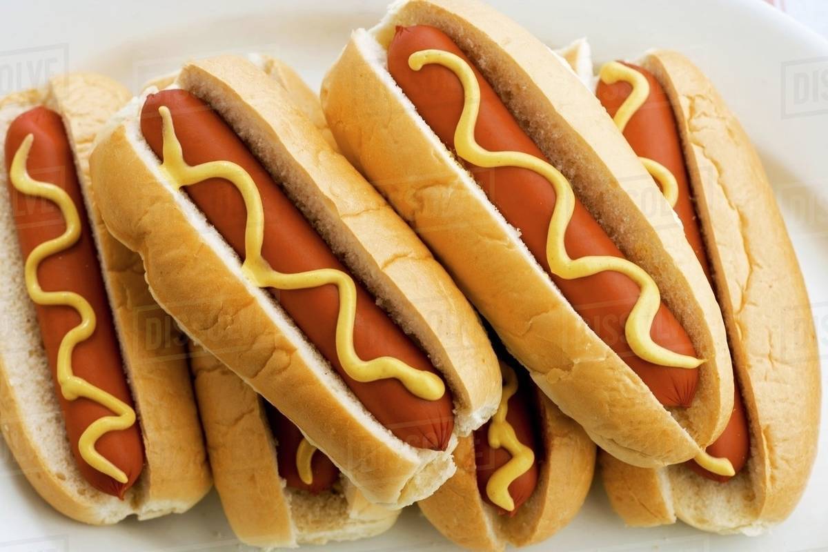 Six hot dogs with mustard - Royalty-free Stock Photo | Dissolve