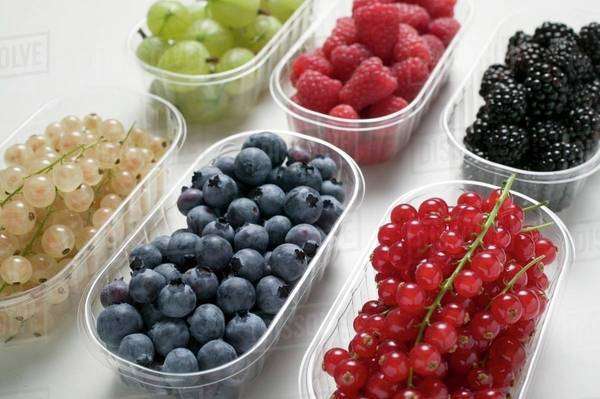 Six plastic punnets of different berries - Royalty-free Stock Photo ...