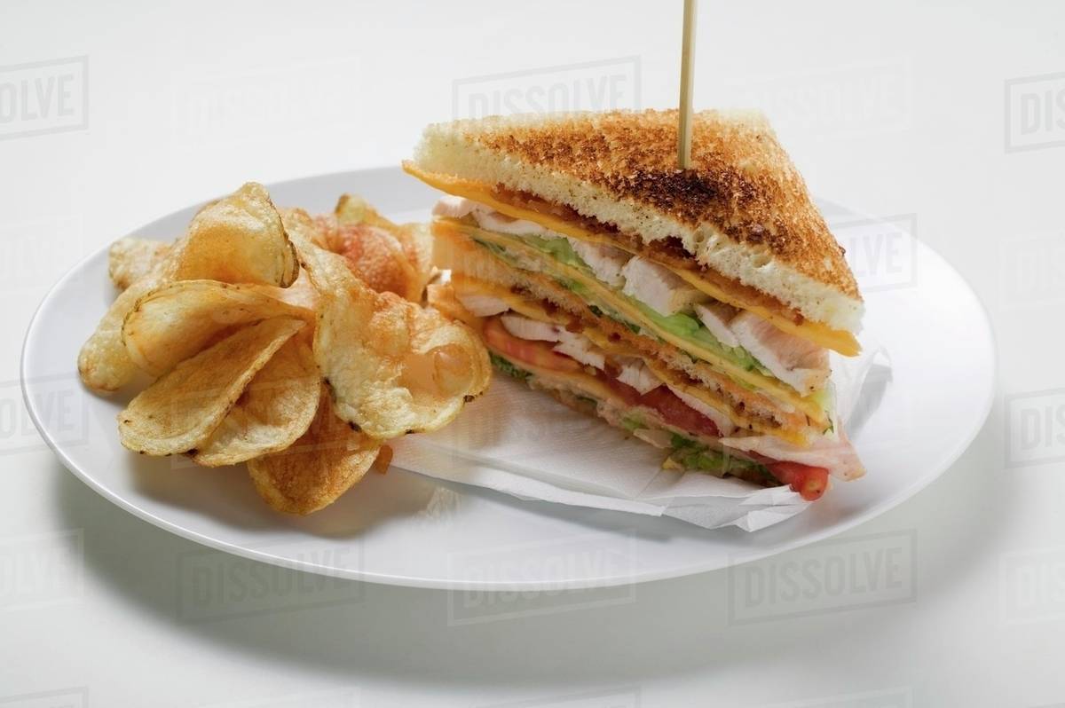 Club sandwiches, toasted, with crisps - Royalty-free Stock Photo | Dissolve