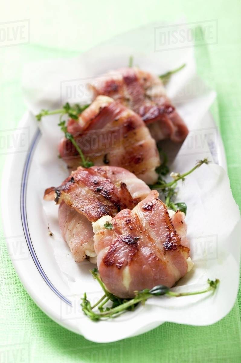 Goat's cheese wrapped in bacon - Royalty-free Stock Photo | Dissolve