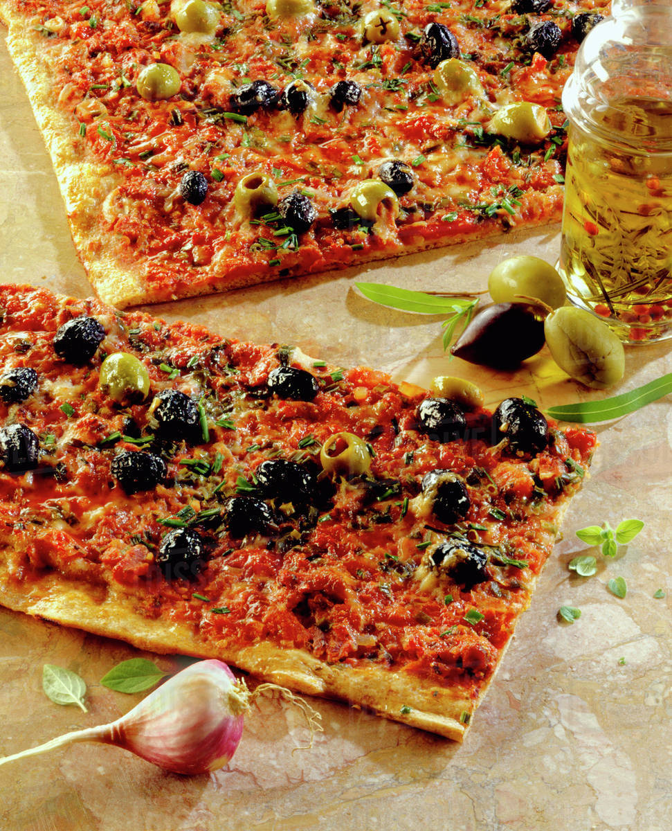 Pizza with green and black olives - Royalty-free Stock Photo | Dissolve