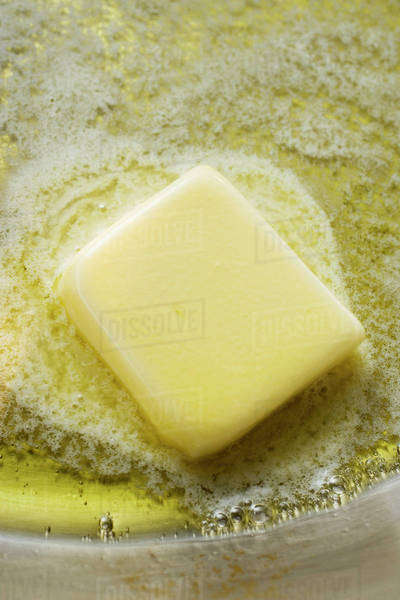 Heating butter in frying pan - Royalty-free Stock Photo | Dissolve