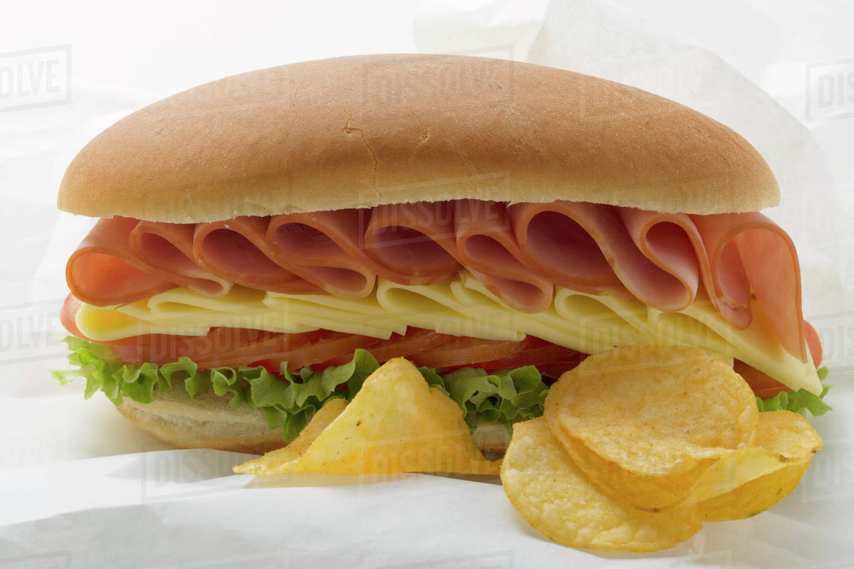 Sub sandwich and crisps on sandwich wrap - Royalty-free Stock Photo ...