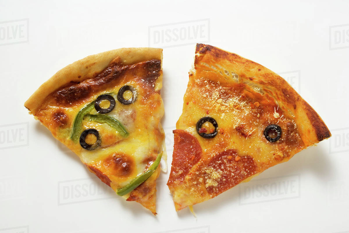 Two pieces of different pizzas - Royalty-free Stock Photo | Dissolve