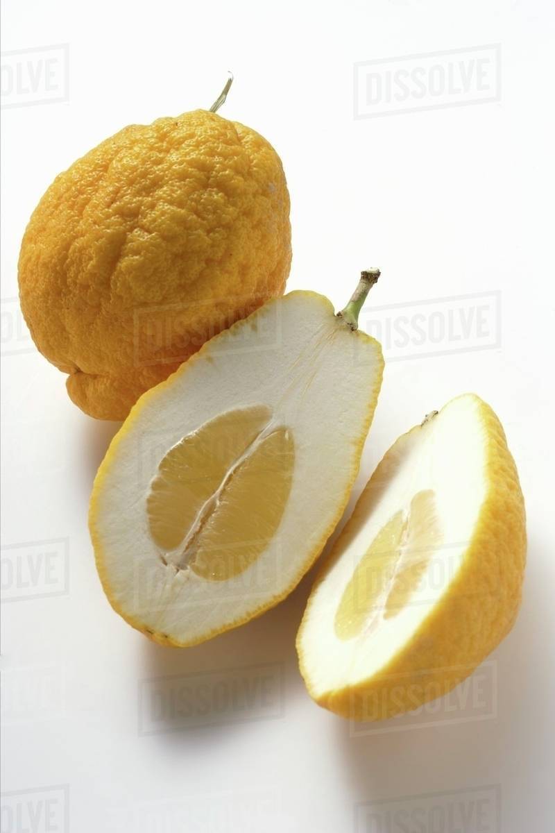 Citrons, whole and halved - Royalty-free Stock Photo | Dissolve