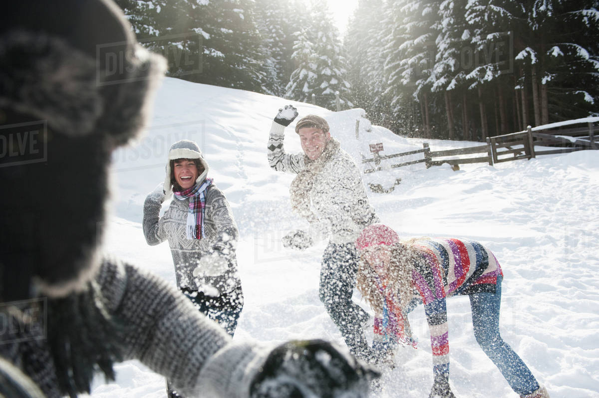 Austria, Salzburg Country, Flachau, Young people snow fighting in snow ...