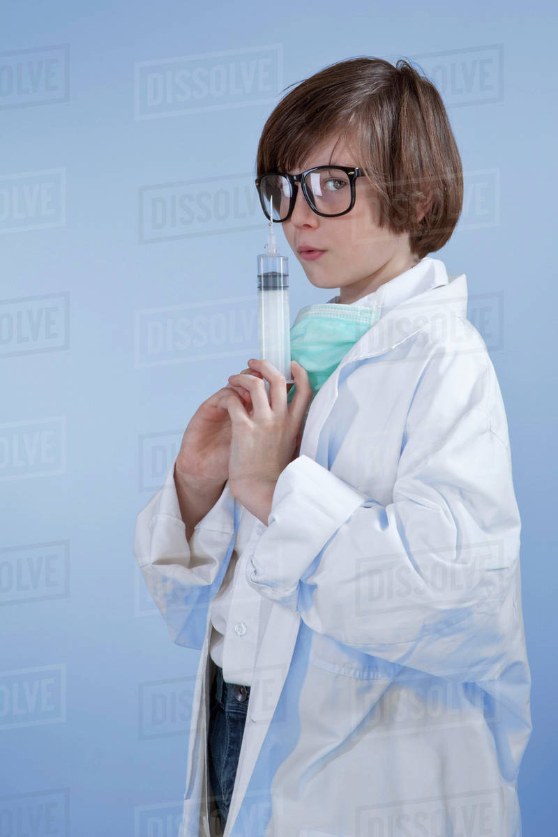 Boy dressed as doctor and holding a medical injection, portrait - Stock ...