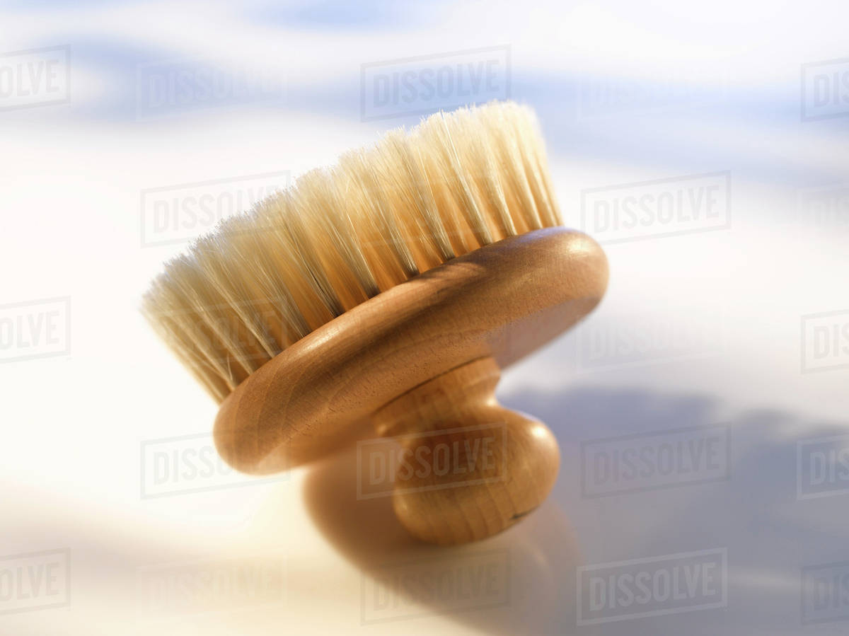 Rounded wooden brush, close up - Stock Photo - Dissolve