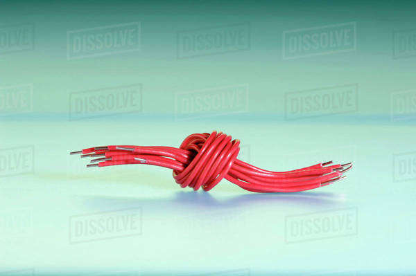 Knotted electrical wires, close-up - Stock Photo - Dissolve