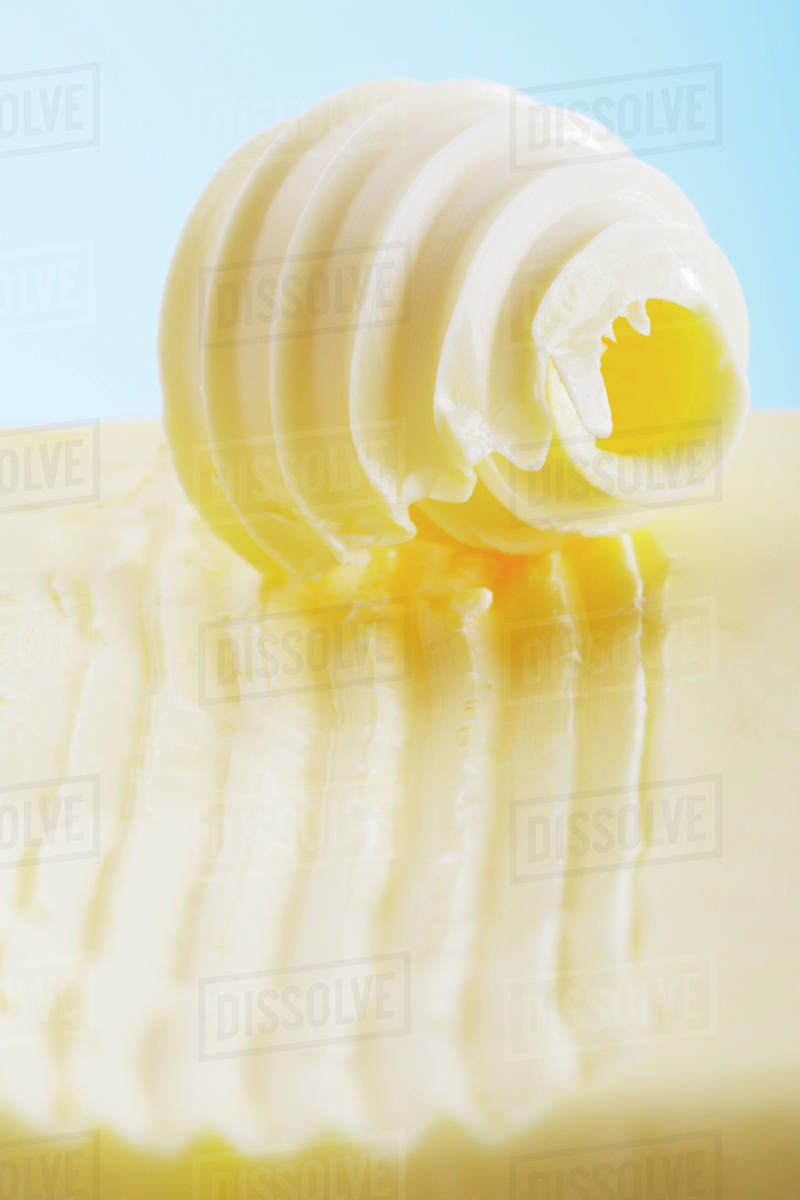 Fresh butter, butter flakes - Stock Photo - Dissolve