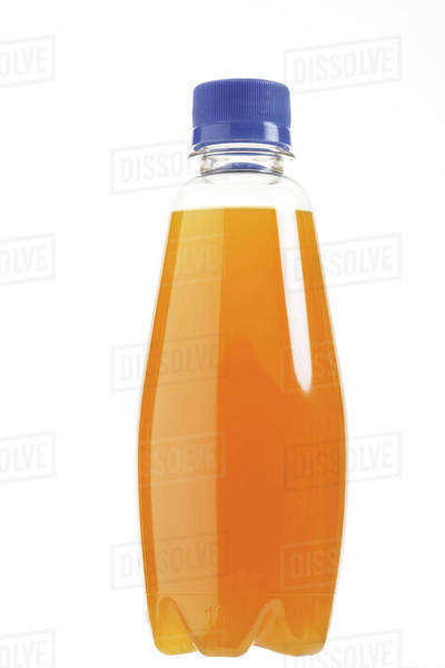 Bottle of orange liquid - Stock Photo - Dissolve