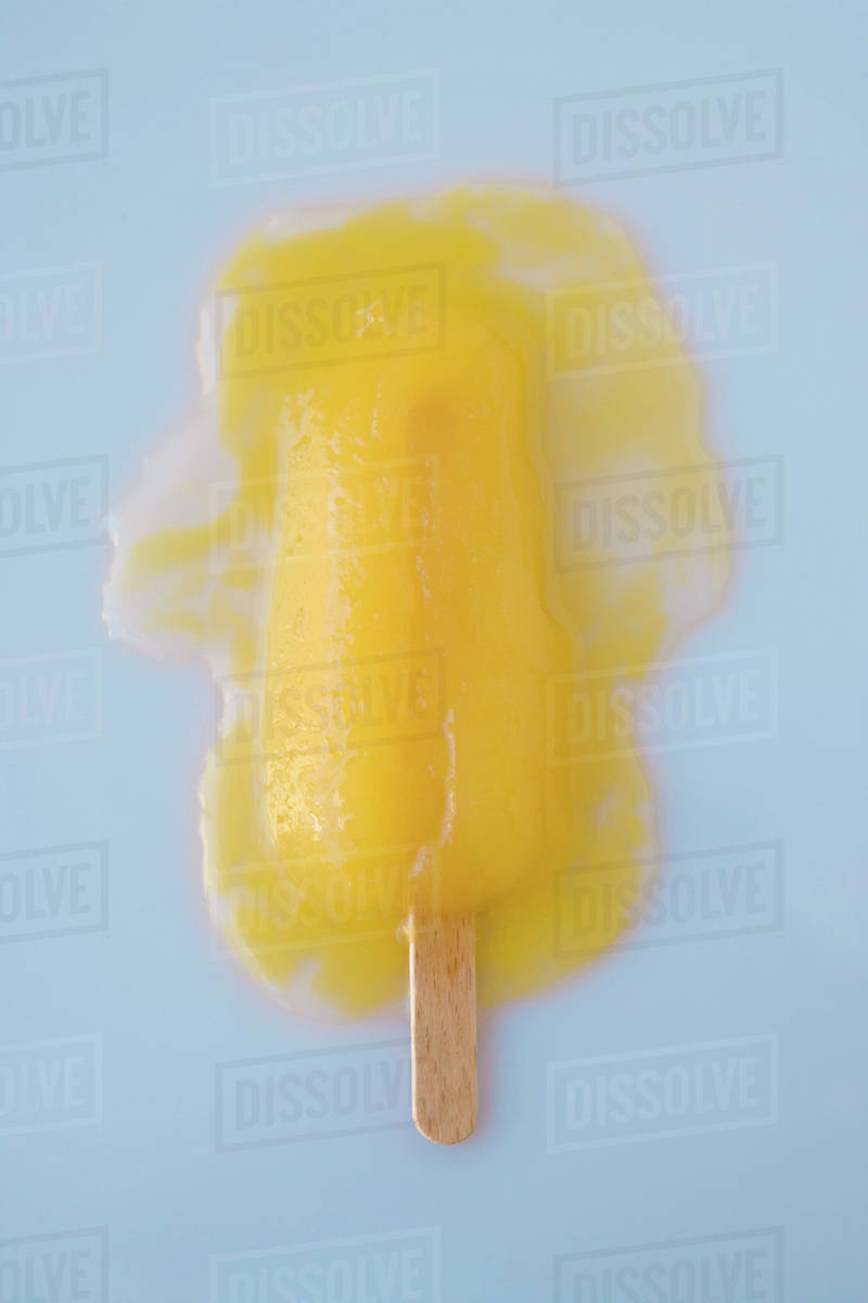 Melted ice lolly stick, overhead view - Stock Photo - Dissolve