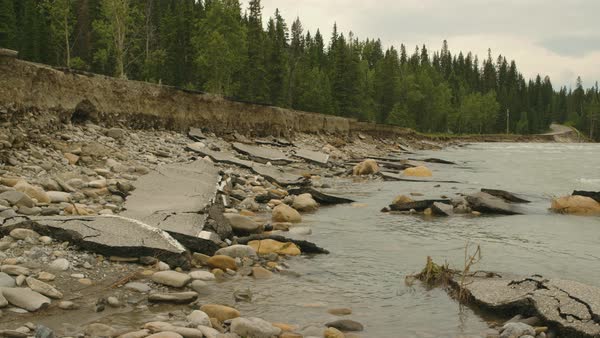 Wide shot of road destroyed by floods in river - Stock Video Footage ...