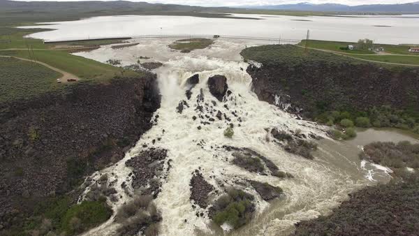 Aerial view of huge overflow waterfall at Magic Reservoir Idaho, as ...