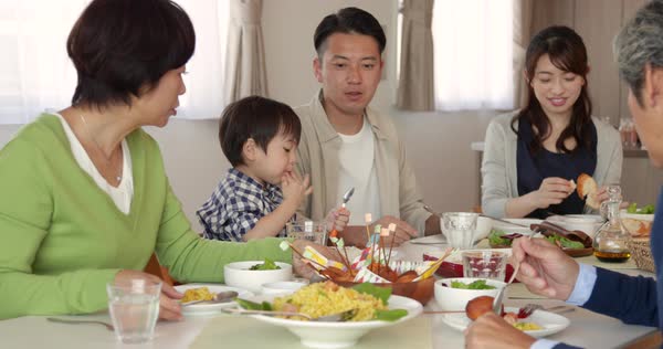 Japanese three-generation family eating together at home - Stock Video ...