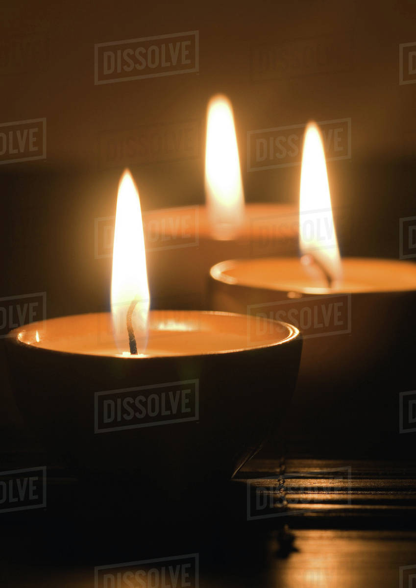 Lit candles - Royalty-free Stock Photo | Dissolve
