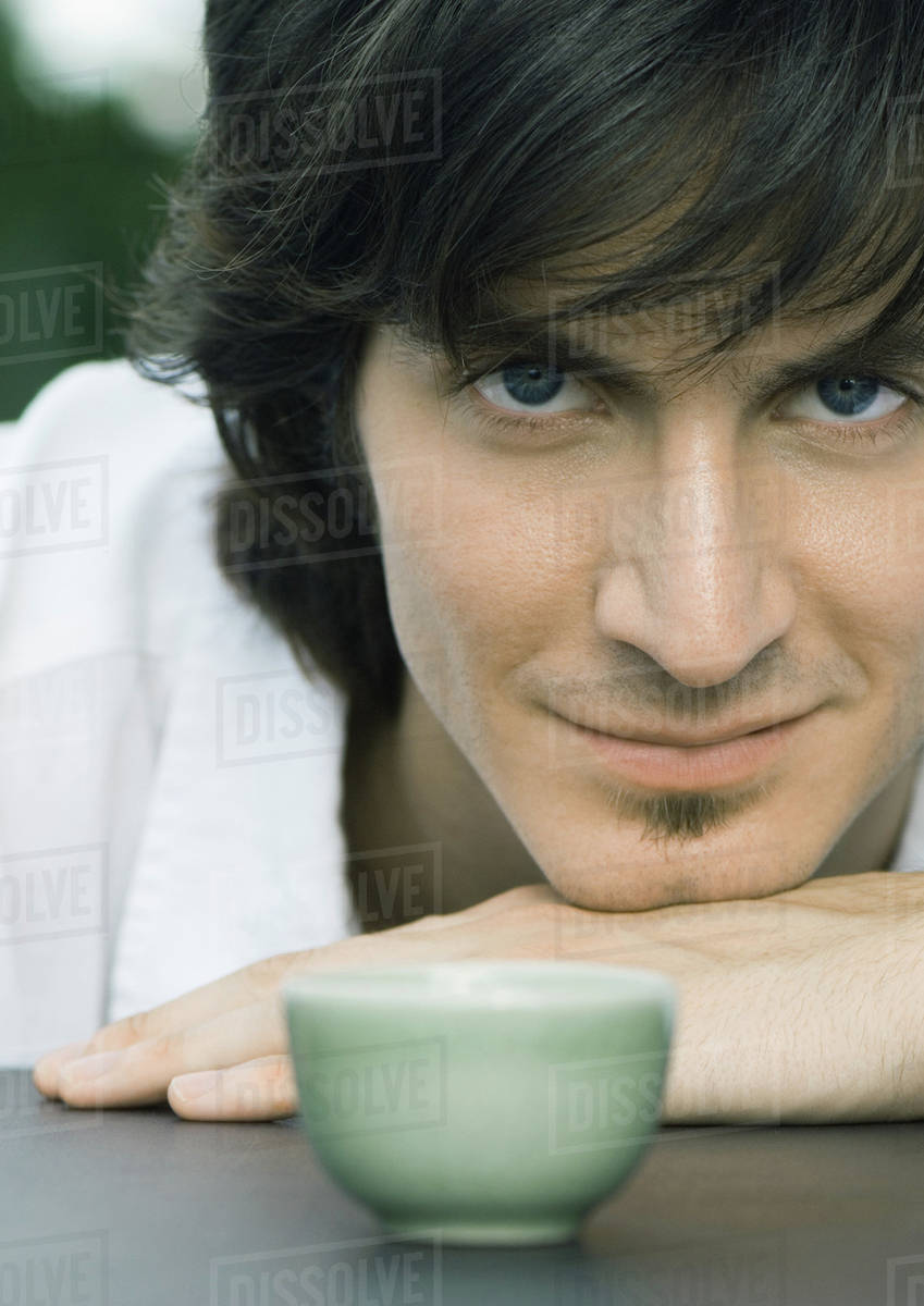 Man with teacup - Stock Photo - Dissolve