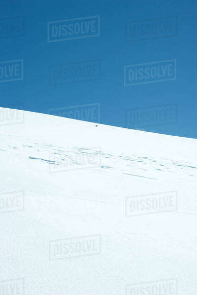 Skiers in far distance - Stock Photo - Dissolve