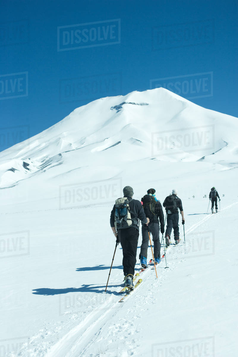 Skiers moving uphill - Royalty-free Stock Photo | Dissolve