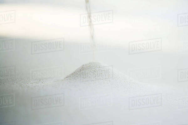 Sand falling onto mound - Stock Photo - Dissolve