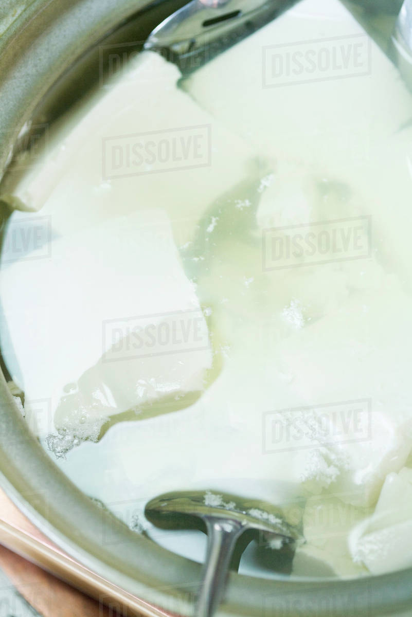 Tofu soaking in water, close-up - Royalty-free Stock Photo | Dissolve