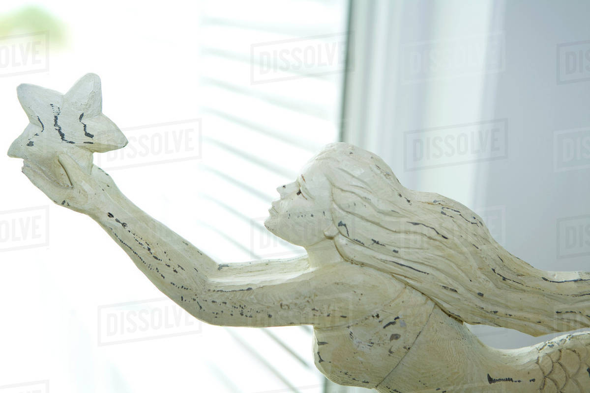 Wooden carving of mermaid, cropped - Royalty-free Stock Photo | Dissolve