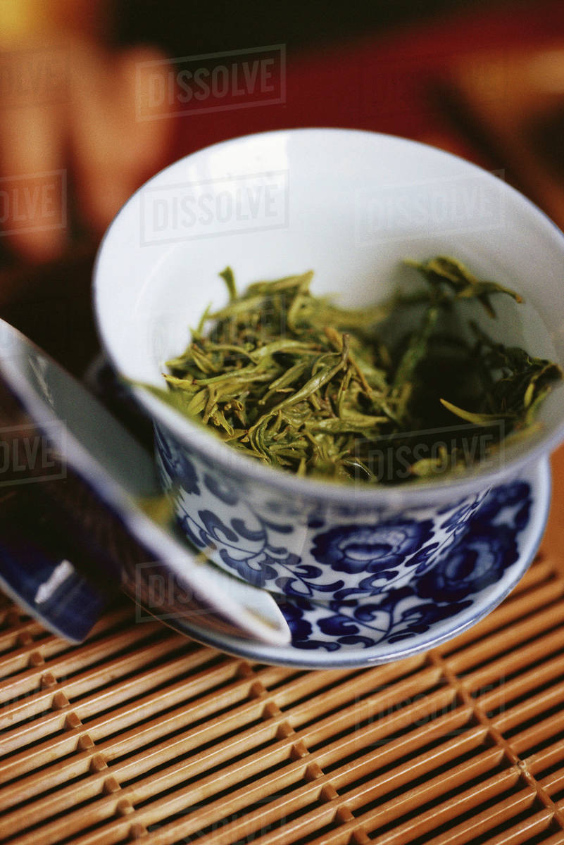Tea leaves in bottom of empty tea cup - Royalty-free Stock Photo | Dissolve