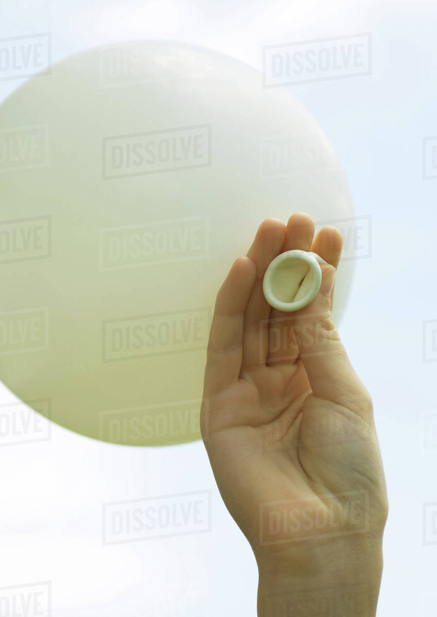 Hand holding up balloon - Royalty-free Stock Photo | Dissolve