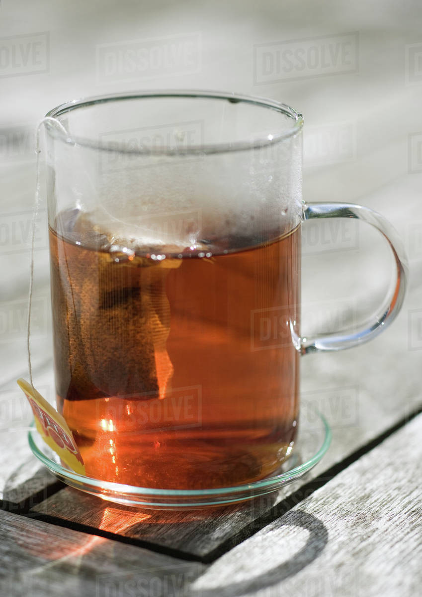 Teabag steeping in mug - Royalty-free Stock Photo | Dissolve