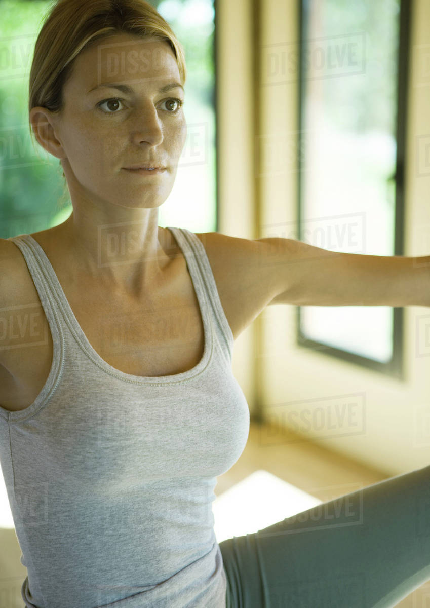 Woman standing with leg up, cropped view - Royalty-free Stock Photo ...