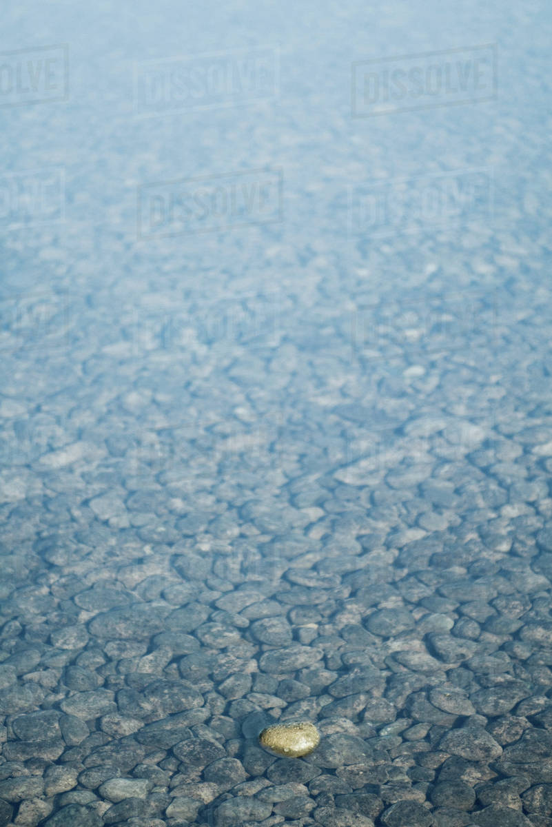Shallow water over pebbles - Royalty-free Stock Photo | Dissolve