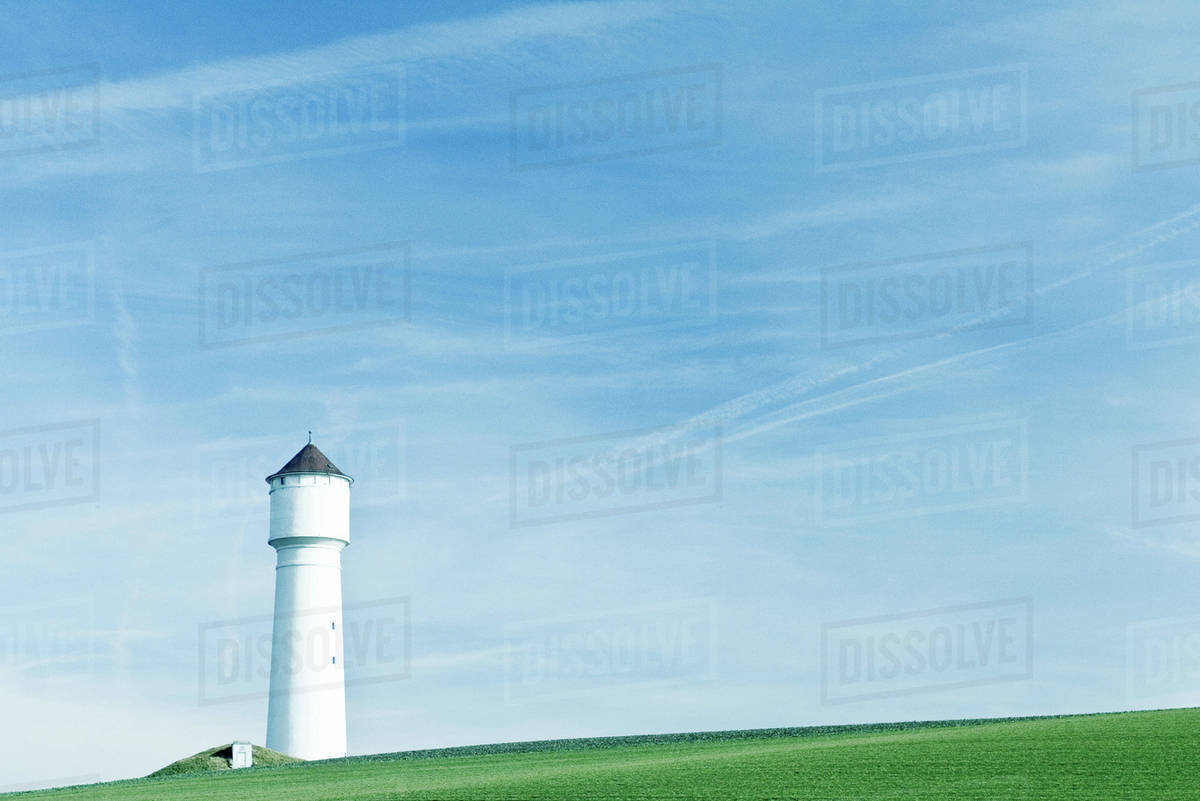 Tower in green field - Royalty-free Stock Photo | Dissolve