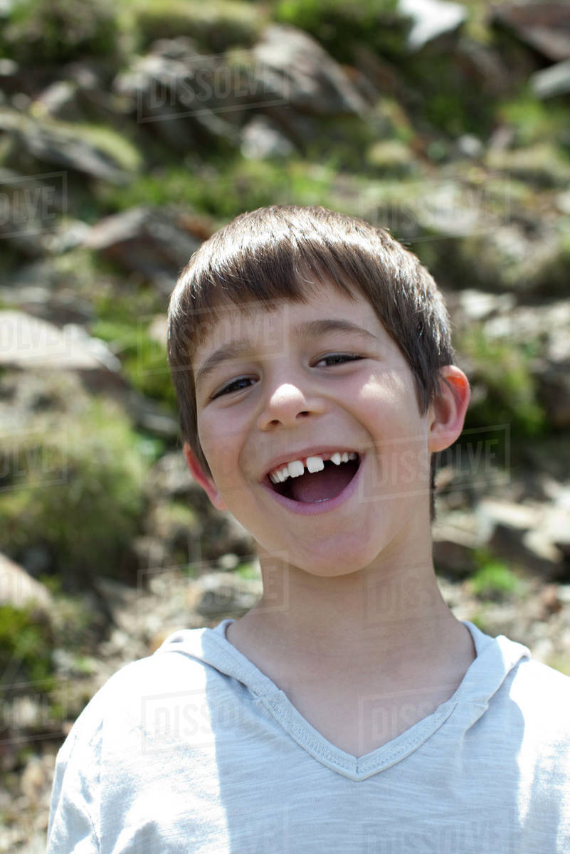Boy laughing, portrait - Stock Photo - Dissolve
