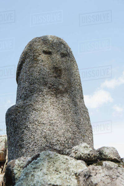 Rock formation resembling human face - Stock Photo - Dissolve