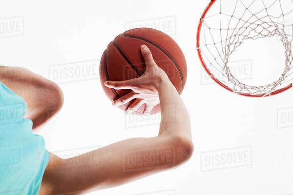 Man attempting to through basketball in to the basket - Royalty-free ...