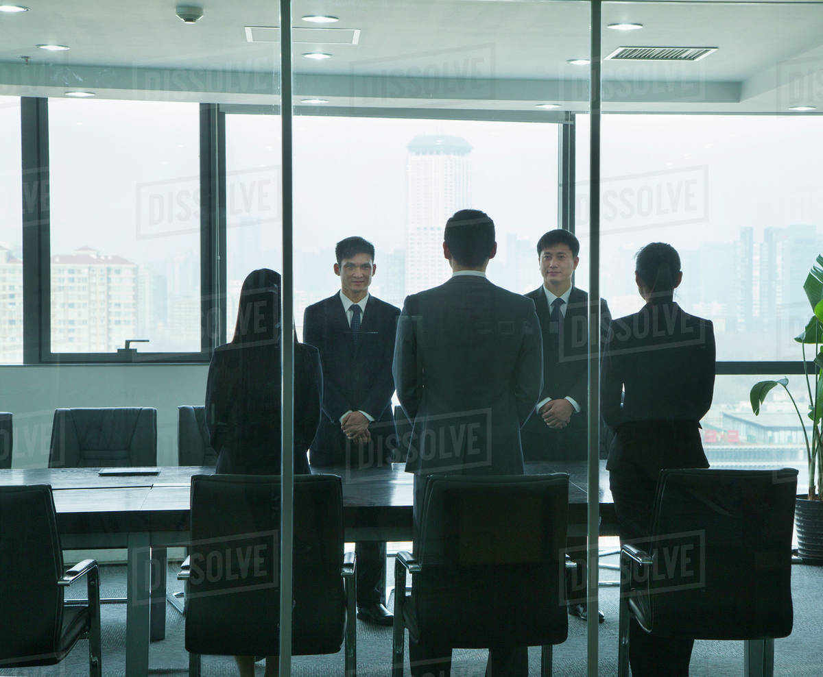Businesspeople Standing in Conference Room - Royalty-free Stock Photo ...