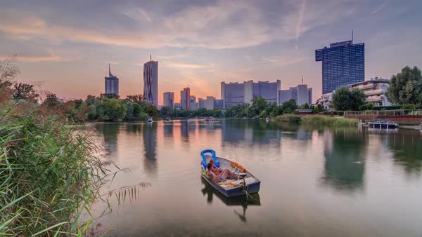 Sunset over Vienna international center skyscrapers with Kaiserwasser ...