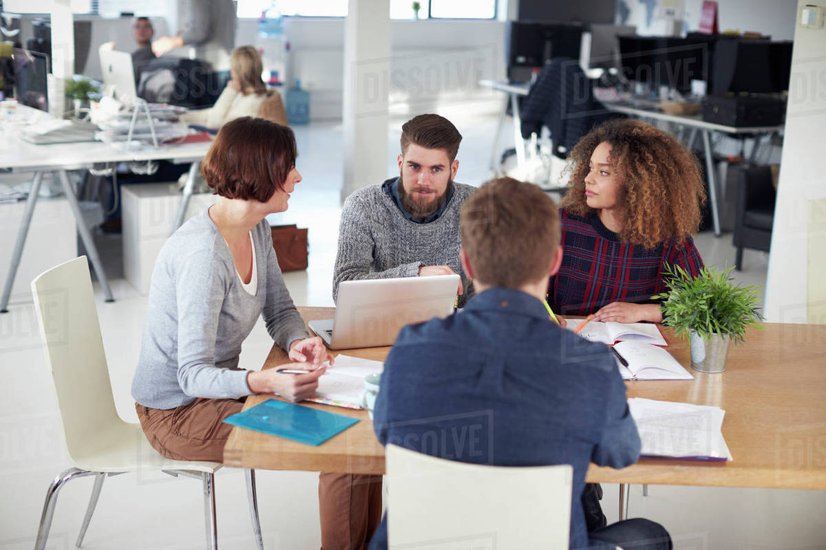 Business meeting in modern busy office - Stock Photo - Dissolve