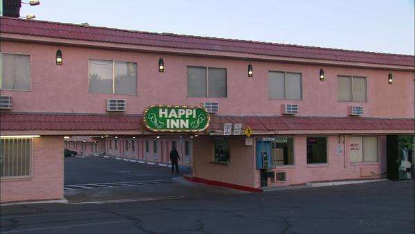 Zooming in shot outside view of a motel - Stock Video Footage - Dissolve