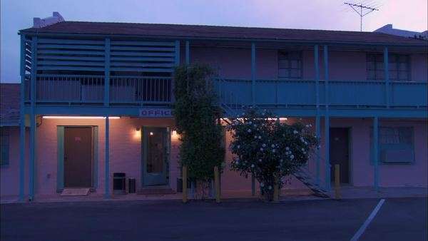 Static shot of two story motel built in Spanish style in Nevada - HD ...