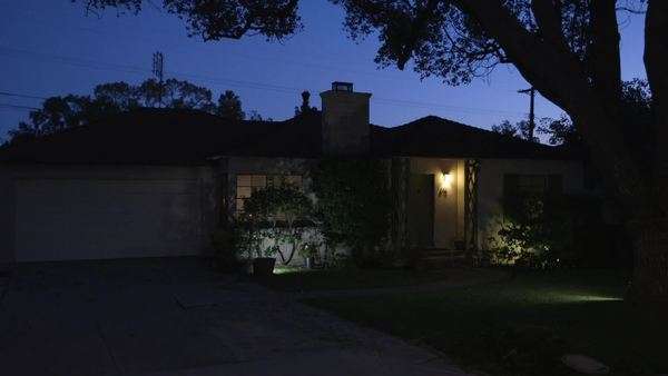 Static shot of a suburban house at night - Stock Video Footage - Dissolve