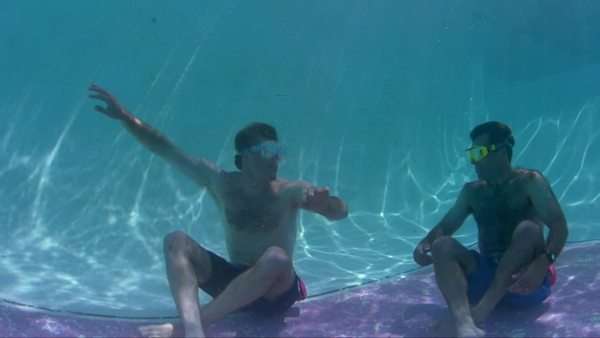 Hand-held shot view of two men playing a game underwater - HD Rights ...