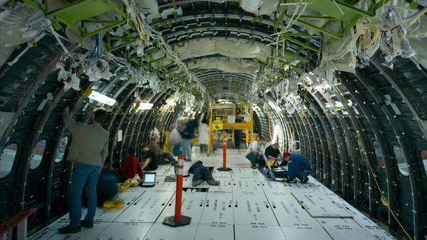 Montage of engineers inside an airplane manufacturer. Originally ...