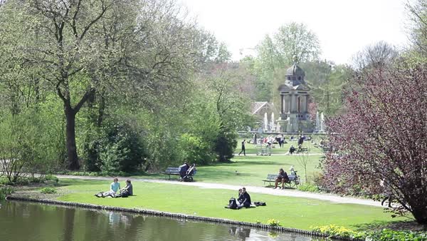 Relaxing at waters edge in Sarphatipark in Amsterdam, Netherlands - HD ...