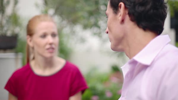 Man and woman having a conversation outdoors - HD Royalty-free Stock ...