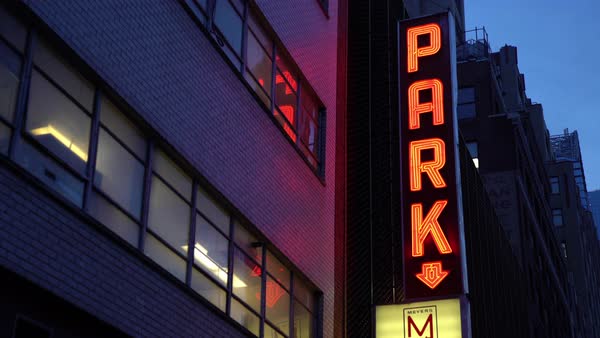 Neon parking garage sign illuminated at night - Stock Video Footage ...