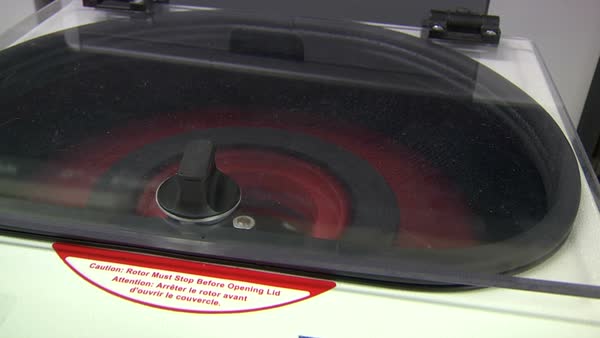 Hospital lab spinning blood sample - Stock Video Footage - Dissolve