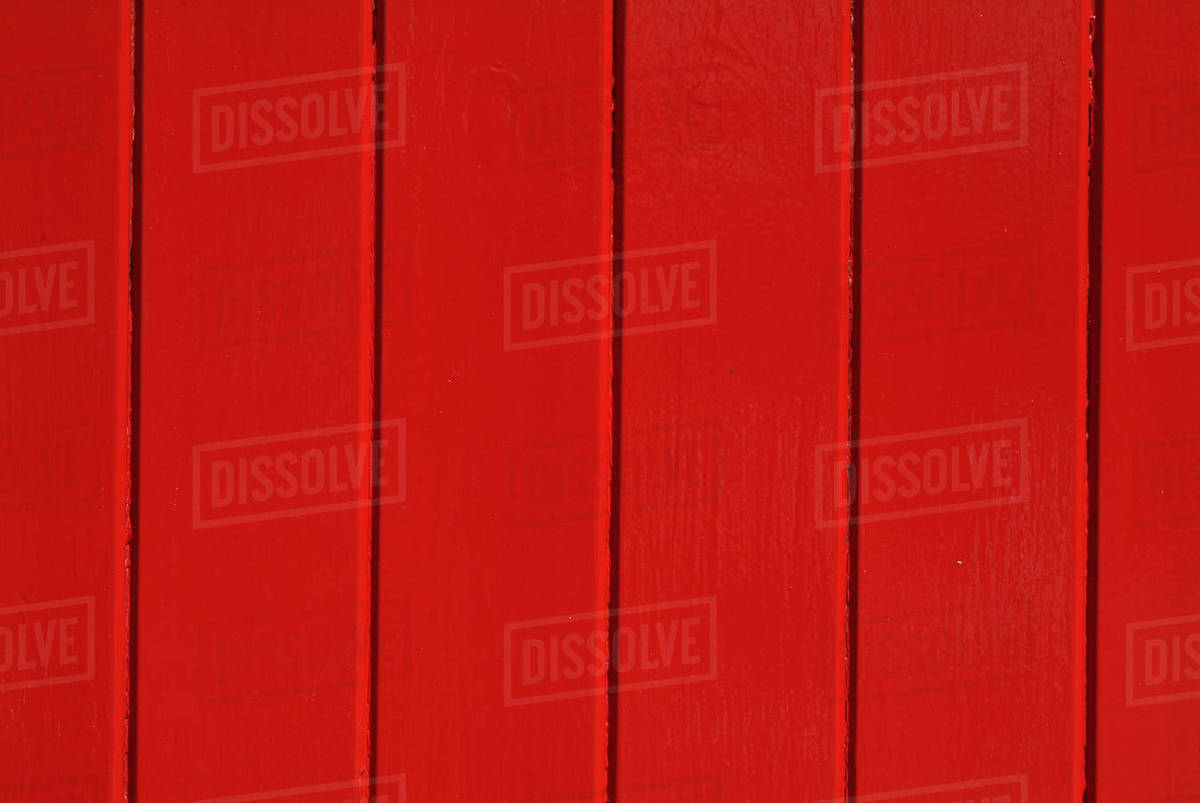 Close up of a red painted timber building. - Stock Photo - Dissolve