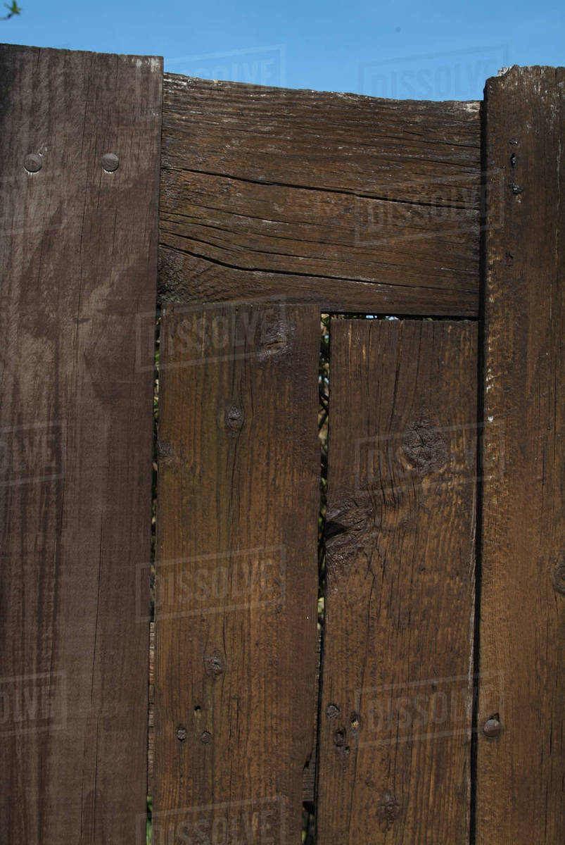 Close up of a chunky wooden gate. - Royalty-free Stock Photo | Dissolve