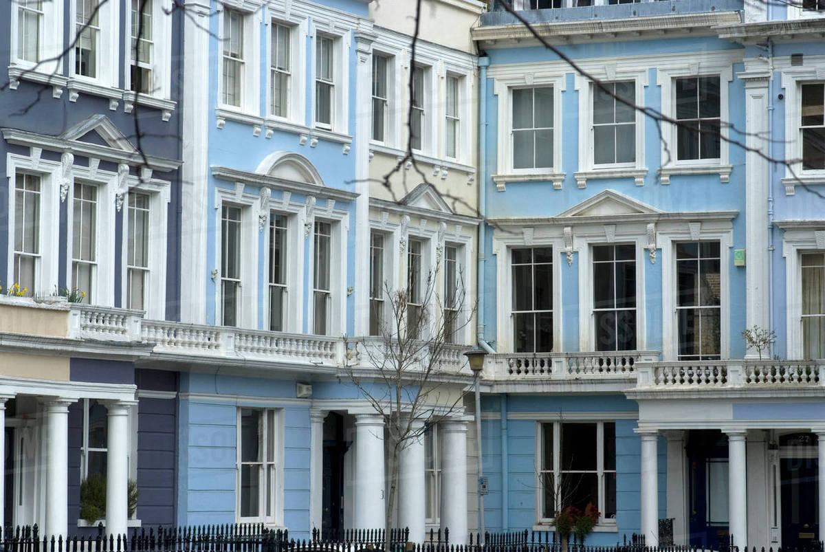A section of coloured terrace houses - Stock Photo - Dissolve